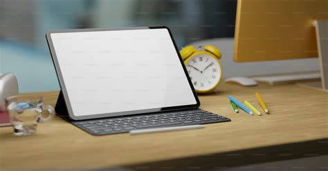 클로즈업 빈 화면 디지털 태블릿 및 복사 공간 창의적인 공간 3d 렌더링 3d 그림이 있는 가정 작업 공간 사진 Unsplash의 컴퓨터 이미지