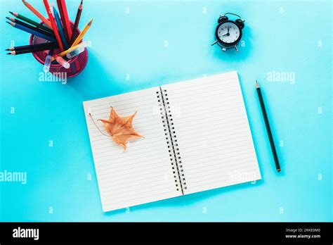 Blank Notepad And School Supplies Alarm Clock Pencil And Yellow