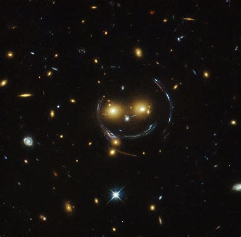 Hubble Spots A Cluster Of Galaxies That Looks Like A Massive Smiley