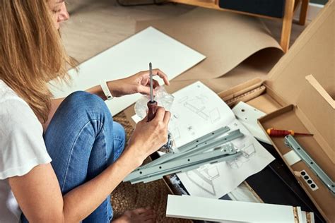 Premium Photo Woman Reading Manual Instruction To Assemble Furniture