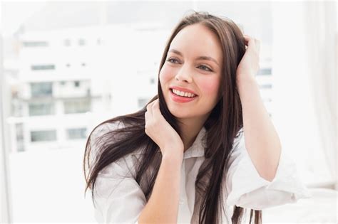 Premium Photo Pretty Brunette Smiling On Bed