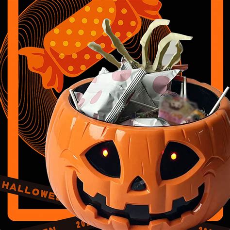 halloween candy dish with sensor triggered weird hand device pumpkin
