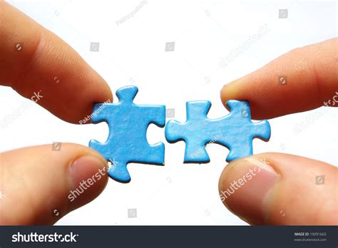 Hands Holding Two Puzzle Pieces Stock Photo 19091665 Shutterstock