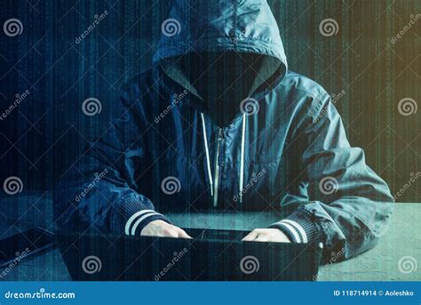Anonymous Hacker Programmer Uses A Laptop To Hack The System Stealing