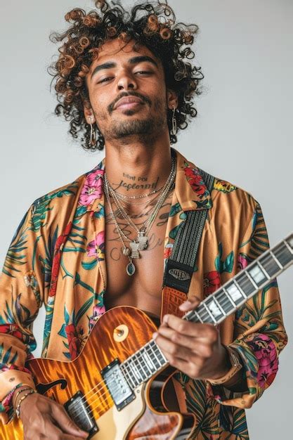 A Man With Curly Hair Playing A Guitar Premium Ai Generated Image