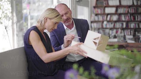 Architect Explaining Model To Customer Stock Photo