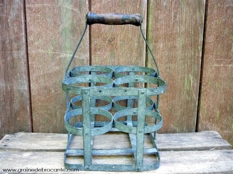Porte bouteille ancien en fer et poignée bois