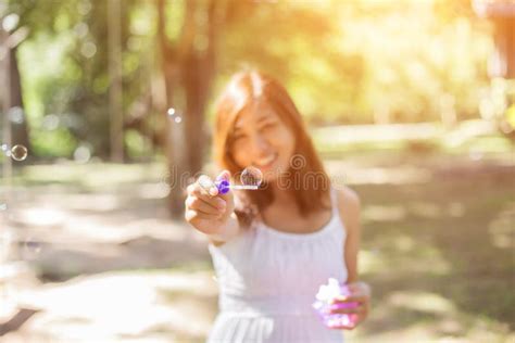 A Beautiful Woman Blowing Bubbles Stock Image Image Of Person Girl
