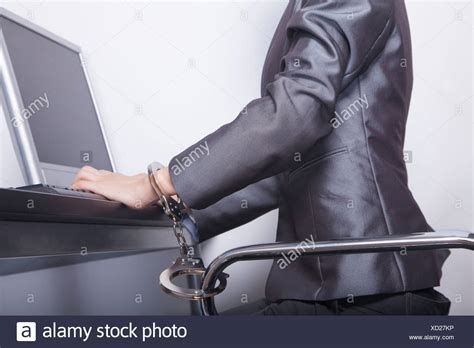 Young Businesswoman Handcuffed Office Chair High Resolution Stock