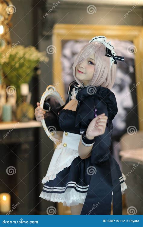 Portrait Of Girl With Japanese Maid Costume In Vintage Restaurant Stock