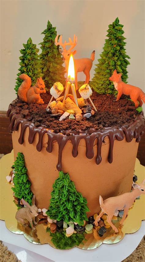 Campfire Cake With Chocolate Icing And Animal Decorations
