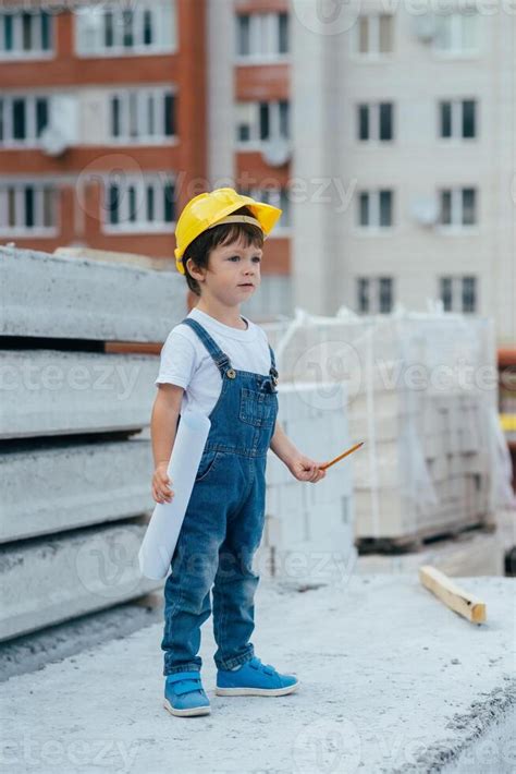 Architect In Helmet Writing Something Near New Building Little Cute