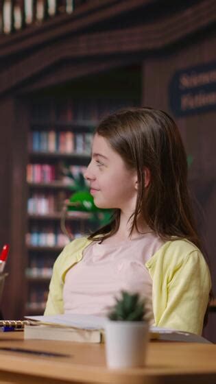 Vertical Elementary Students Receiving Support From A Tutor Working On