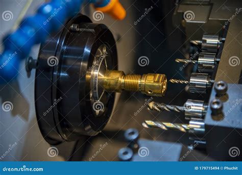 The Multi Tasking CNC Lathe Machine Swiss Type Tapping At The Brass Shaft Stock Photo Image