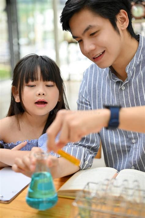 Portrait Cute Young Asian Girl Is Excited With A Science Experiment