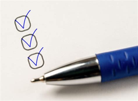 Premium Photo Three Checkboxes Hand With Pen Writing Check Mark On