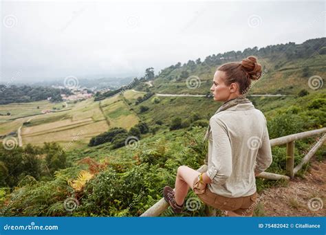Seen From Behind Woman Hiker Enjoying Beautiful Landscape View Stock