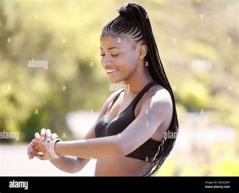 Exercise Fitness And Watch With Woman Reading Results On Digital Smartwatch After Running