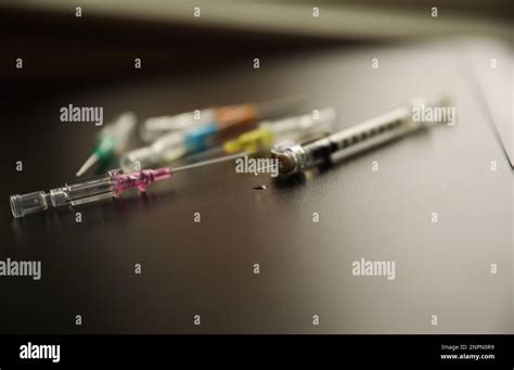 Flu Vaccine And Needle Syringes Showing Opioid Crisis Needle Therapy