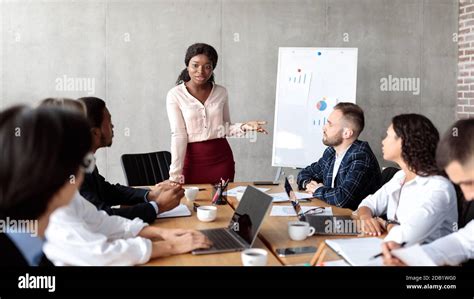 African American Businesswoman Giving Speech During Corporate Meeting