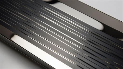 Sleek Metallic Surface With Reflective Textures And Elegant Patterns