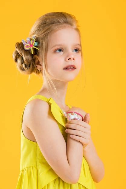 Premium Photo Girl Posing On Yellow Background