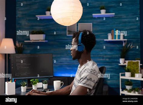 Programmer Man Wearing Headphones Typing Binary Code For Website Security Working Remote Frrom