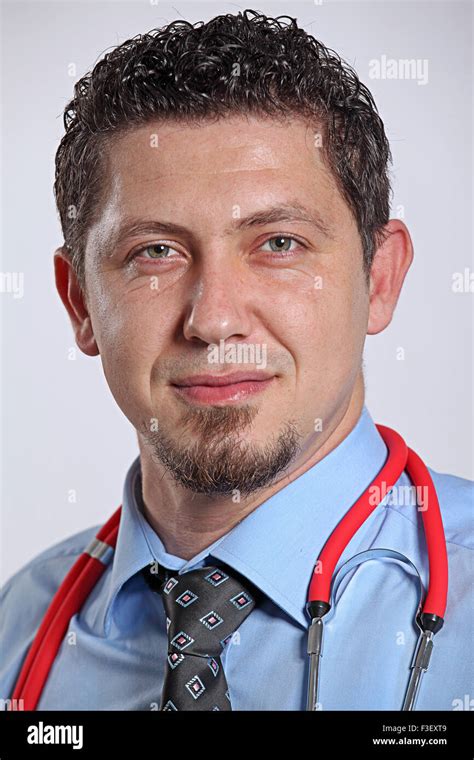 A Mature Handsome Smiling Doctor Wearing His Formal Work Attire Stock