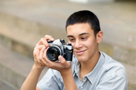 Premium Photo Young Teenage Boy Holding A Vintage Camera
