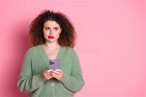 Photo Of Minded Cute Woman Wear Trendy Khaki Clothes Hold Phone Look