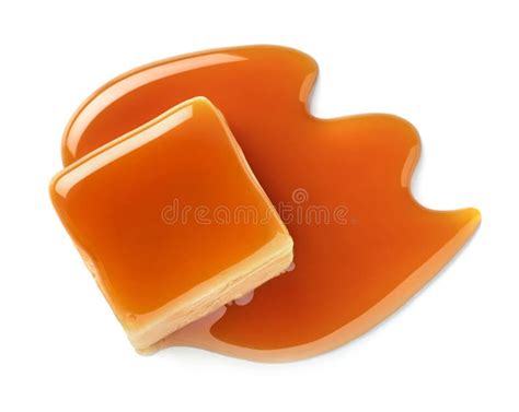 One Sweet Caramel Candy Cube Topped With Caramel Sauce On White