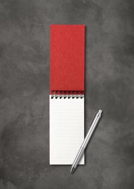 Premium Photo Blank Open Spiral Notebook And Pen Isolated On Dark