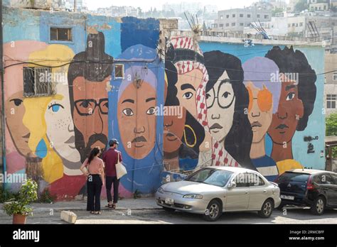 Mural Unity In Diversity Depicting Faces On Nemr Al Edwan Street