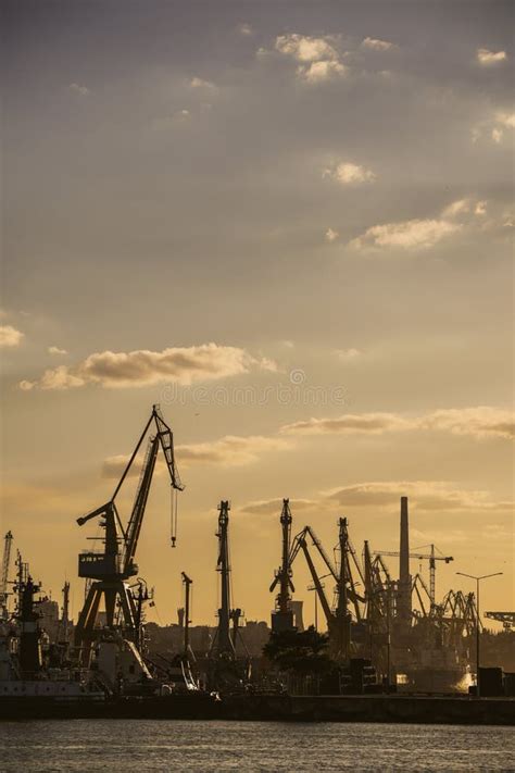 Container Terminal With Cranes In A Commercial Port Stock Image