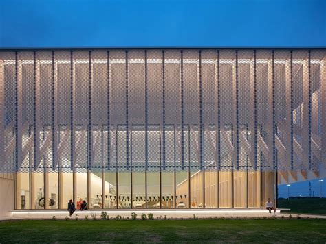 Mjma Architecture And Design Marries Wood And Mesh For Sports Centre