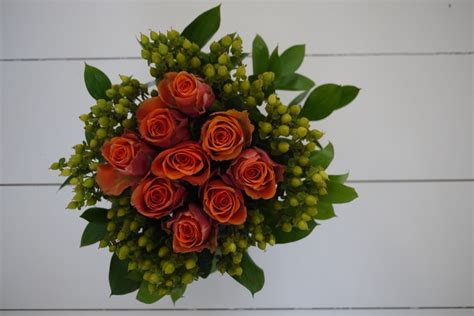 Galvanized Container Hypericum Berry Ruscus And Roses