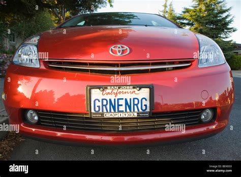A Front View Of Toyota Prius With A Grnenrg Green Energy License