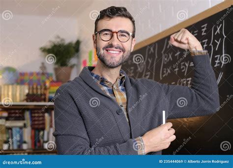 Bodybuilder Teacher Flexing Bicep In Classroom Stock Image Image Of