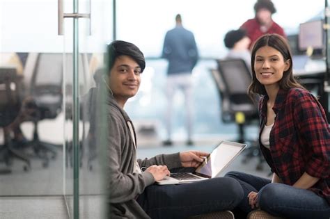 Premium Photo Young Software Developers Couple Using Laptop Computer