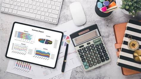 Tablet With Charts And Reports Pen Calculator Notebook Mouse And