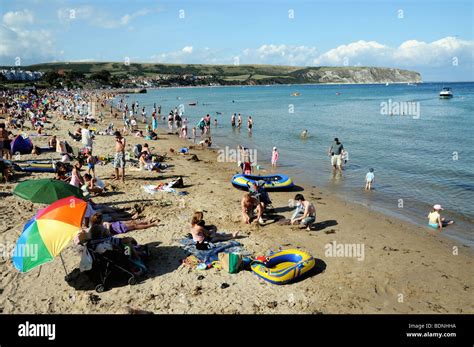 The Beach On A Sunny Summers Day At The Seaside Resort Of Swanage In