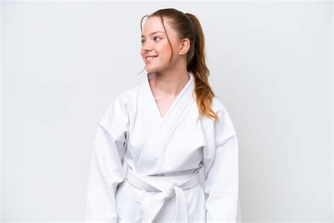 Premium Photo Young Caucasian Girl Doing Karate Isolated On White