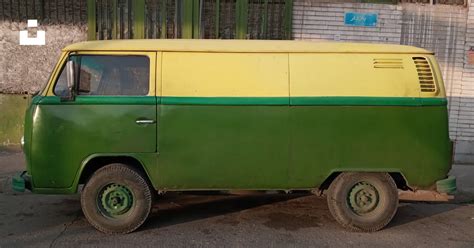 Green And Yellow Van Parked Beside Green Building Photo Free Tehran