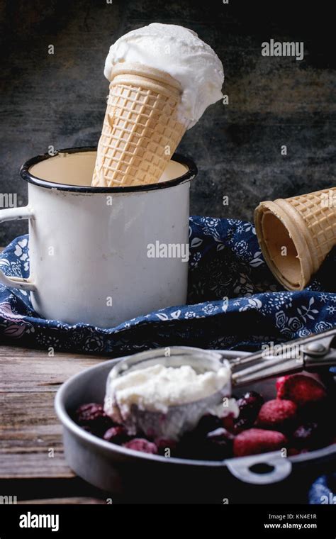 Vanilla Ice Cream In Wafer Cones And Empty Waffer Cones Served In Metal Bowl With Frozen