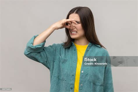 Woman Pinching Nose Stop Breathing Bad Odor Disgusted By Smell Of