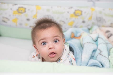 Premium Photo Blue Eyed Baby Boy Lying In Crib