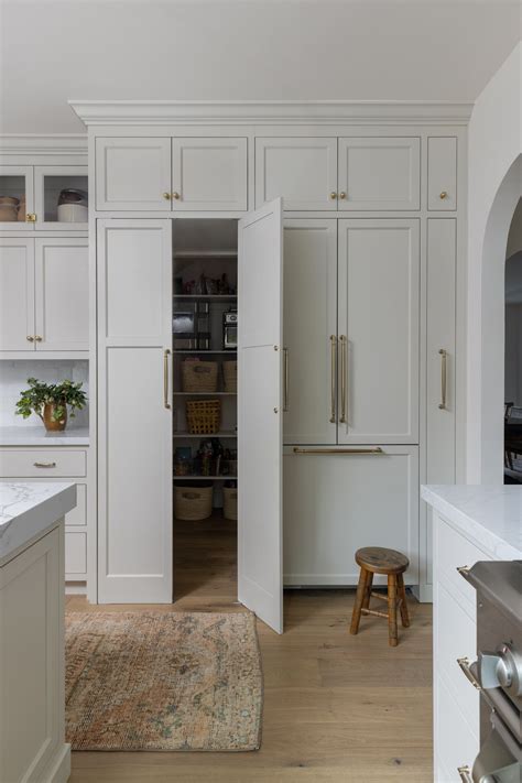 Hidden Pantry In Bright Kitchen