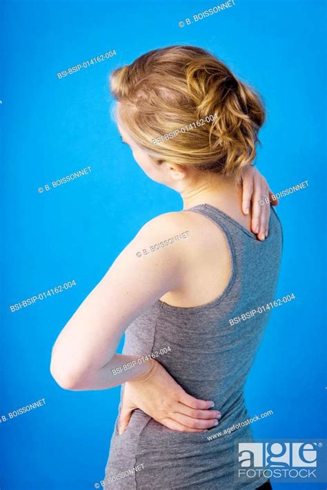 Woman Suffering From Back Pain Stock Photo Picture And Rights Managed