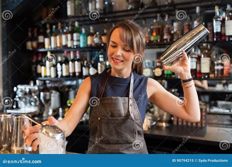 Barmaid With Shaker Preparing Cocktail At Bar Stock Image Image Of