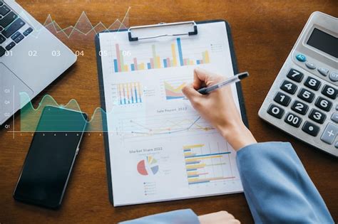 Premium Photo Business Woman Writing Marketing Note On Paper Charts Graphs